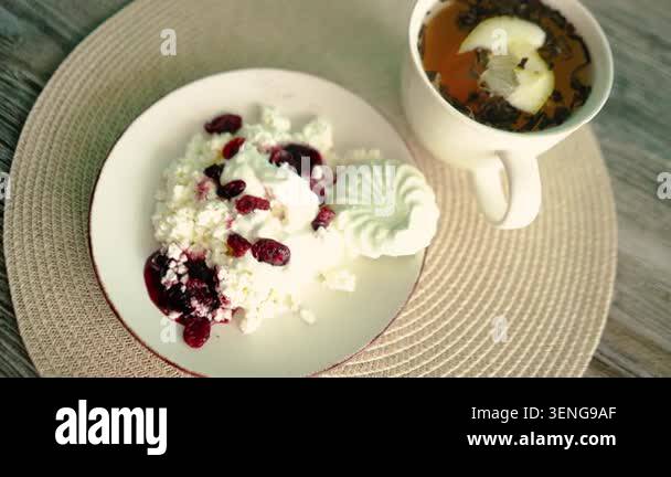 Healthy Cottage Cheese Breakfast with Cranberries and Tea Stock Video ...