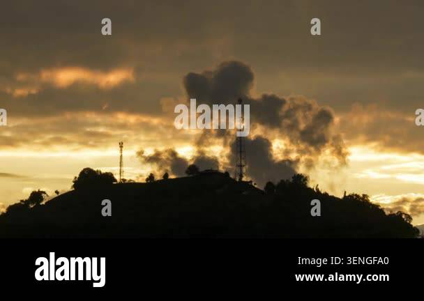 Timelapse footage of light beams among clouds in a gloomy sky covered ...