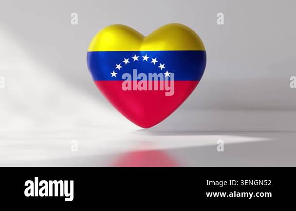 A heart shaped object spins while displaying the colors and design of ...