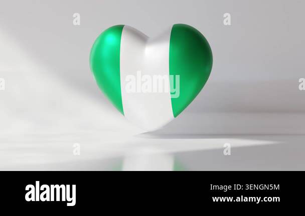 A 3D heart design with a national flag of Nigeria rotates continuously ...