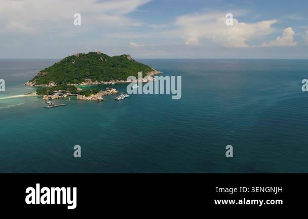 Aerial drone shot flying away from beautiful Koh Nang Yuan island in ...