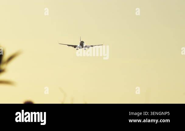 Commercial passenger jet on final approach with landing gear down ...