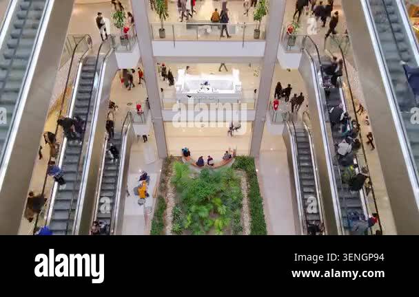 Time-lapse footage of people movement and escalators inside the ...
