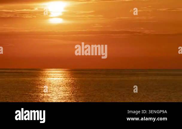 Orange red sunset. Time-lapse footage of a clear sky and sunlight ...