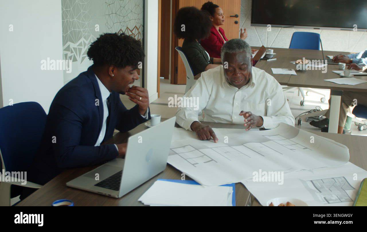 Two Men Discussing Technical Drawings Stock Video Footage - Alamy