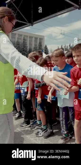 Chisinau, Moldova - June 1, 2026 Marathon. Children in red shirts ...