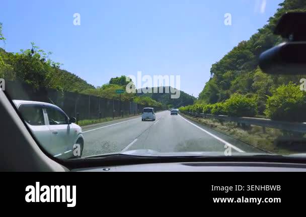 KUMAMOTO, JAPAN - APRIL 16, 2026: Point of view from a car driving on a ...