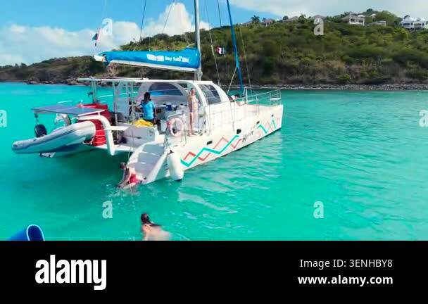 SAINT MARTIN - JANUARY 22, 2026: Drone view of tourists jumping from ...
