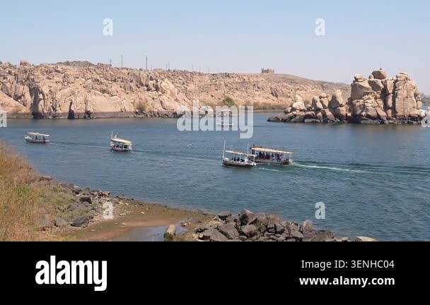 Traditional motorboats carrying tourists navigating the nile river ...