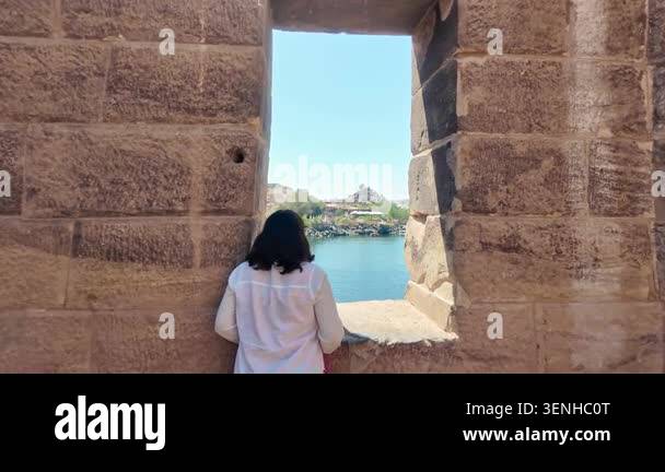 Tourist woman looking at the beautiful landscape of the nile river from ...