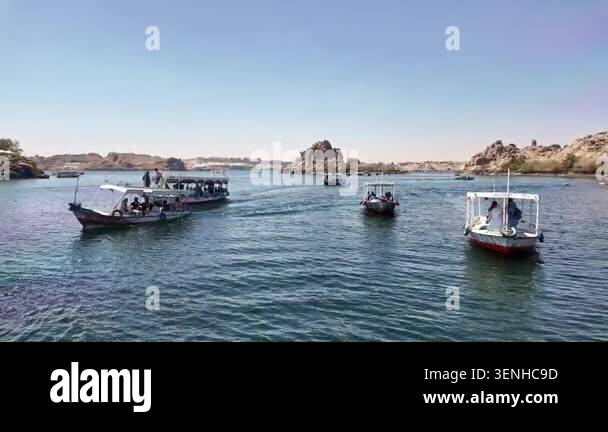 Philae, aswan, egypt - march 10 2026: egyptian water taxis carrying ...