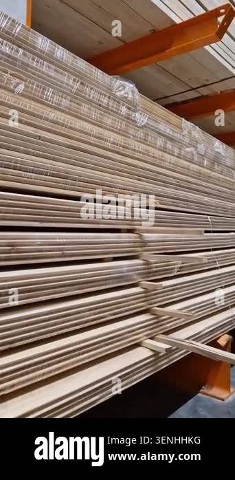Wooden lining made of softwood in bundles. A stack of wooden panels ...