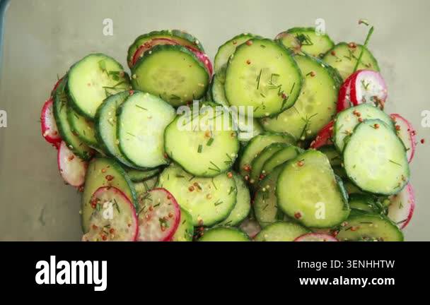 Close-up of a simple summer salad with crisp sliced cucumbers and ...