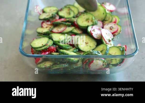 Close-up of a simple summer salad with crisp sliced cucumbers and ...