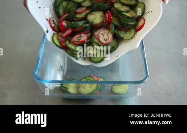 Close-up of a simple summer salad with crisp sliced cucumbers and ...