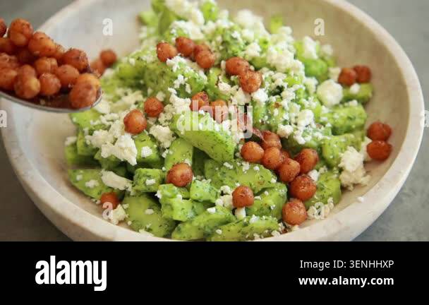 Close-up of a high-protein fitness salad with crispy chickpeas, feta ...