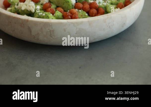 Close-up of a high-protein fitness salad with crispy chickpeas, feta ...