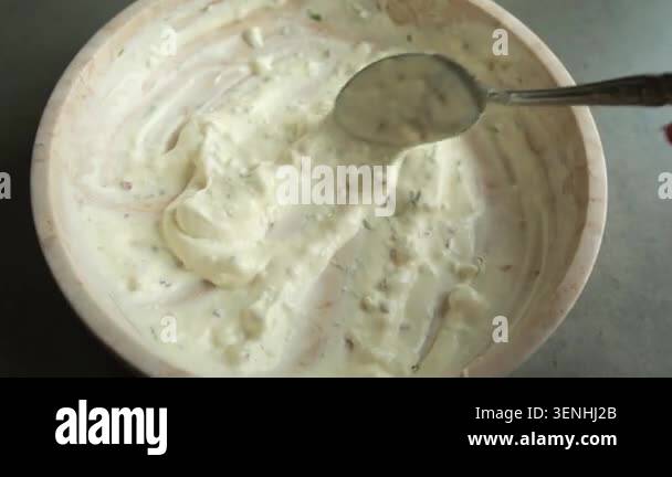 Close-up of whisking a creamy and zesty Mexican-inspired hot salad ...