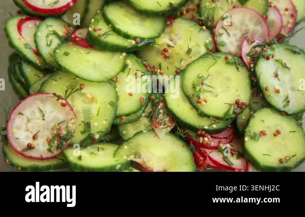 Close-up of a simple summer salad with crisp sliced cucumbers and ...