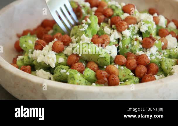 Close-up of a high-protein fitness salad with crispy chickpeas, feta ...