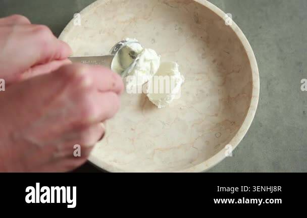 Close-up of whisking a creamy and zesty Mexican-inspired hot salad ...
