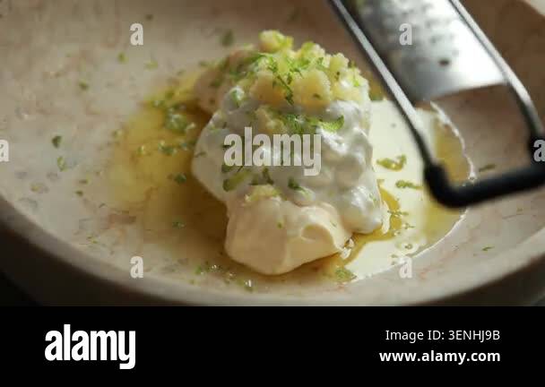 Close-up of whisking a creamy and zesty Mexican-inspired hot salad ...