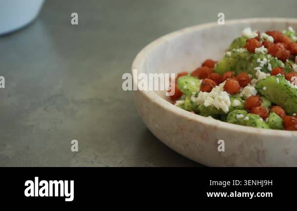 Close-up of a high-protein fitness salad with crispy chickpeas, feta ...