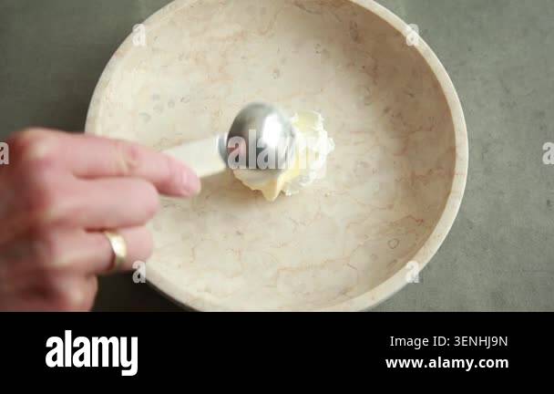 Close-up of whisking a creamy and zesty Mexican-inspired hot salad ...