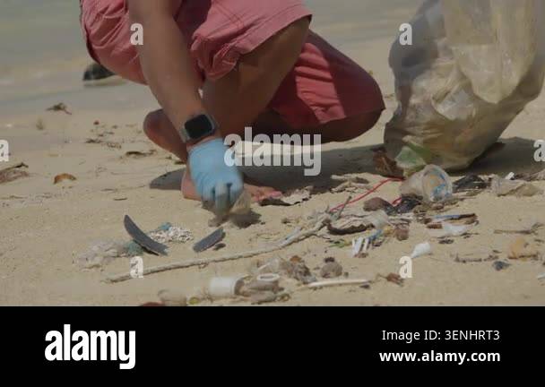 Hand Picking Up Plastic Waste from Sandy Beach During a Cleanup ...
