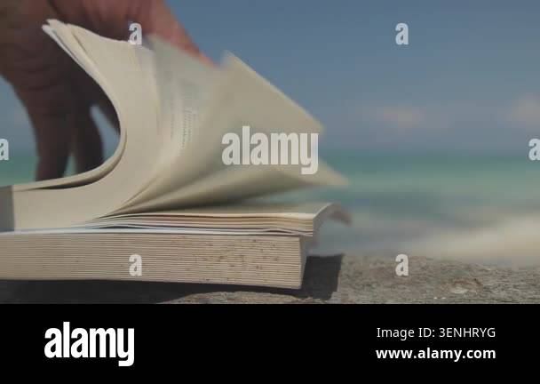 Close-Up of a Book Open on a Tropical Beach, Combining Travel ...