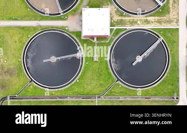 Aerial view of municipal wastewater treatment plant showing multiple ...