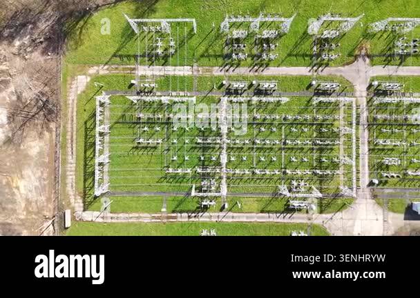 Aerial perspective of an electrical substation featuring power lines ...