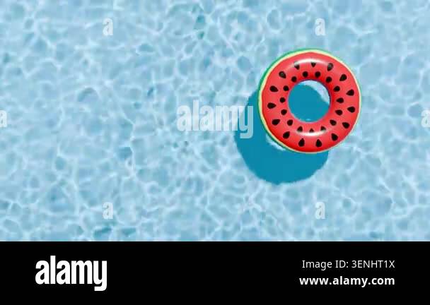 Watermelon swim ring in the empty clear pool. Swimming pool top view ...