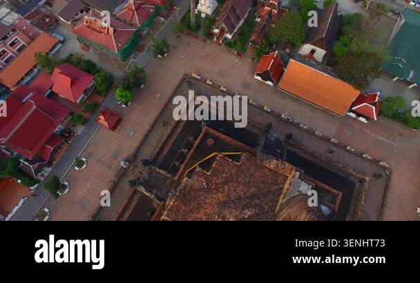 High angle drone shot capturing the grandeur of Wat Chedi Luang temple ...