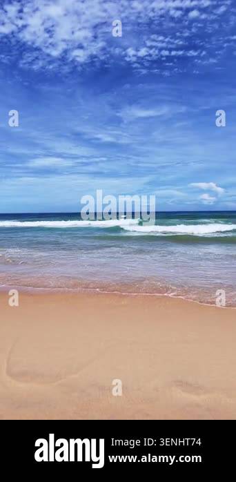 Smooth Waves Hitting the Shoreline at Sunset Stock Video Footage - Alamy