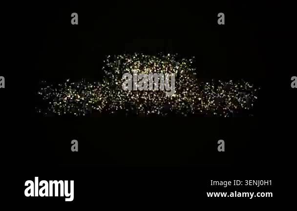 Golden particles forming 15th anniversary text on black background ...