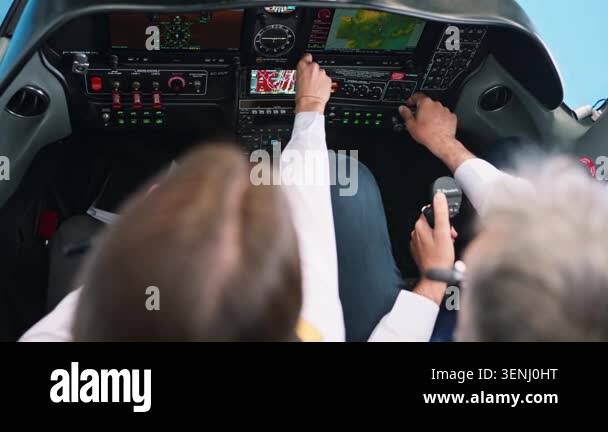 Two skilled aviators managing the flight controls and navigation ...