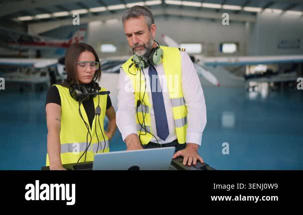 Professional aviation team consisting of a pilot and a mechanic working ...
