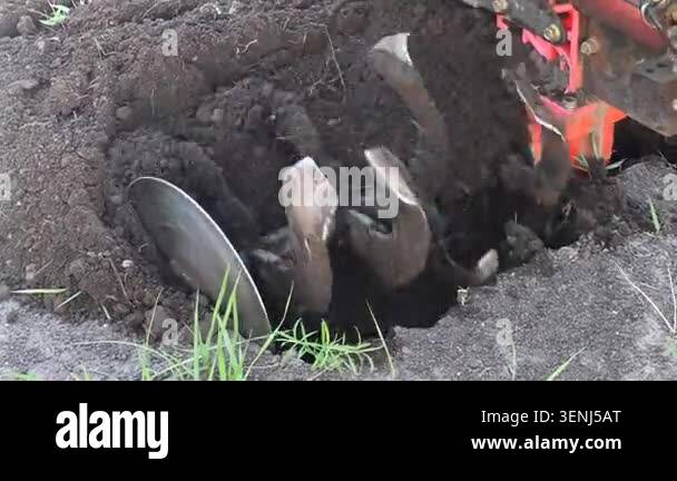 Agricultural tractor tilling soil with cultivator Stock Video Footage ...