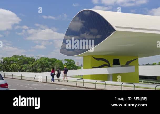 Footage showcases a modern eye-shaped building, embodying contemporary ...