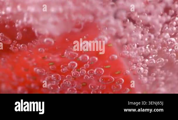 Super Slow Motion Closeup Strawberry In Soda With Rising Bubbles Stock ...
