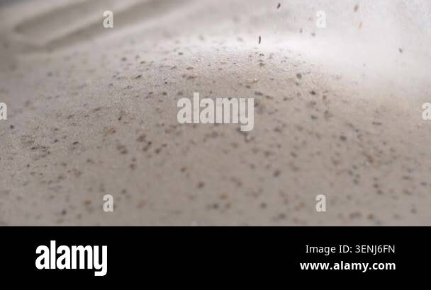 Super Slow Motion Closeup Sand Grains Falling Slowly On Ceramic Surface ...