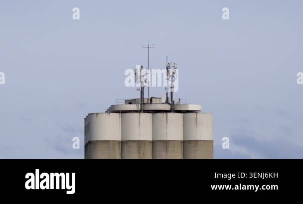 Concrete Silos Topped With Antennas And Small Masts, Compact ...