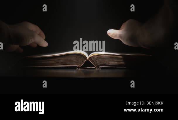 Hands Turning Pages Over Book In Low Light, Sequential Closeups Show ...