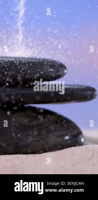 Super Slow Motion Black Stacked Stones With Falling Water Droplets ...