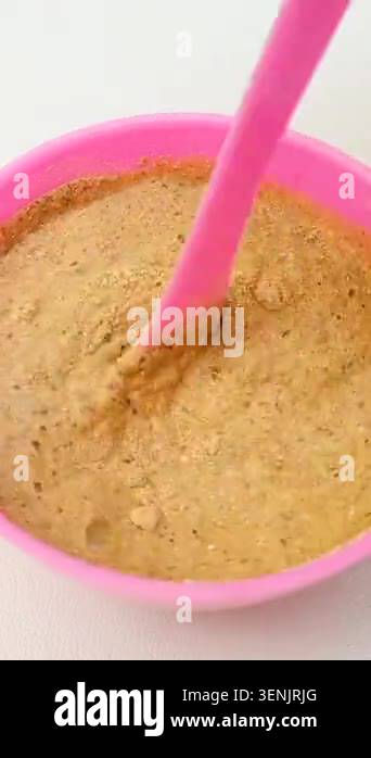 Traditional Ayurvedic Ubtan Powder Mixing Process in Pink Plastic Bowl ...