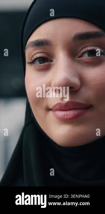 Portrait smiling Muslim Arabian business woman in hijab looking at ...