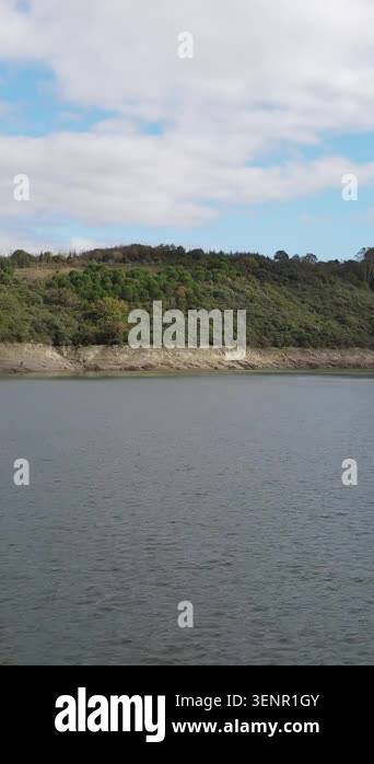 Lake barrage aerial drone view, dam lake formed between mountains and ...