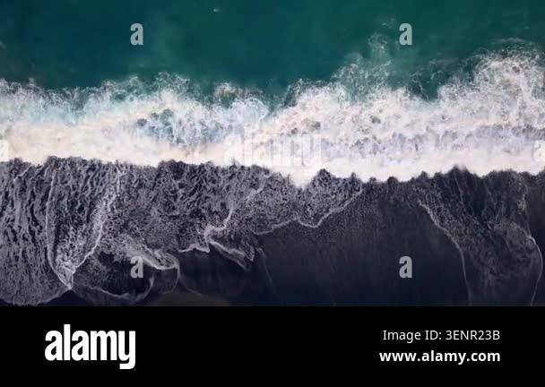 Aerial Top View of Ocean Waves Crashing on Black Sand Beach Stock Video ...