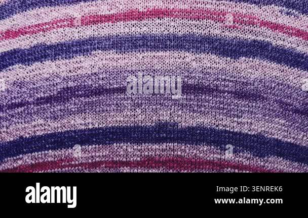 purple striped knitted fabric texture panning slowly reveals cozy ...